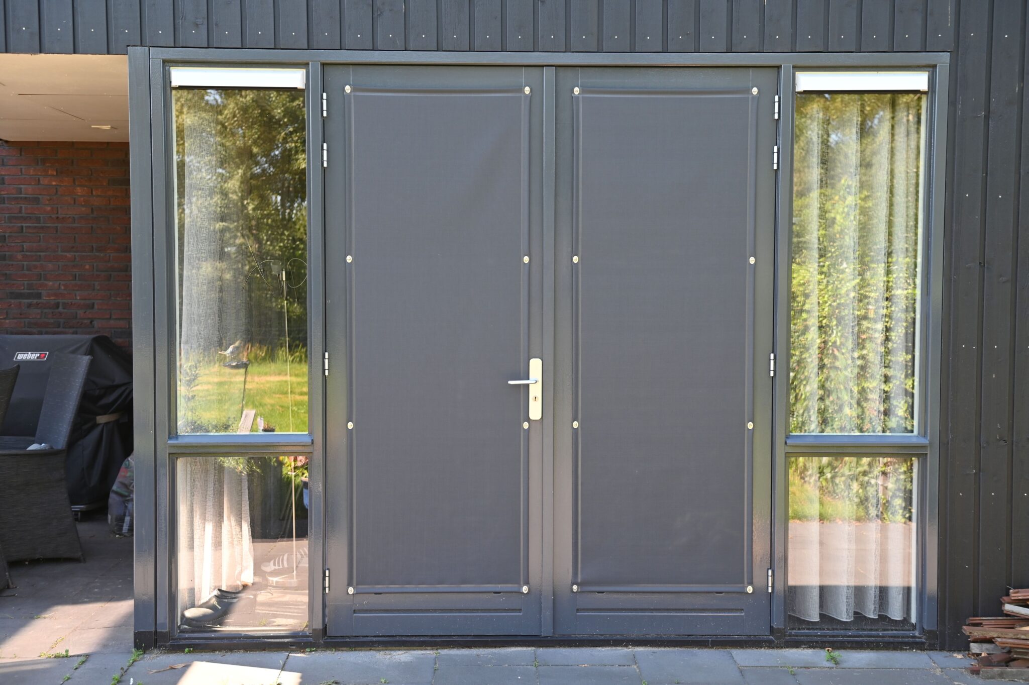 Zonwering bij openslaande deuren - De Haan Westerhoff Zonwering